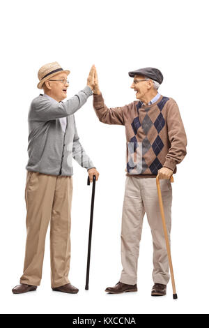 Two senior men high fiving Stock Photo - Alamy