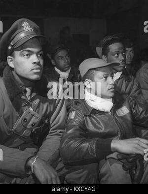 The Tuskegee Airmen, pilots of the 332nd Fighter Group, are shown ...