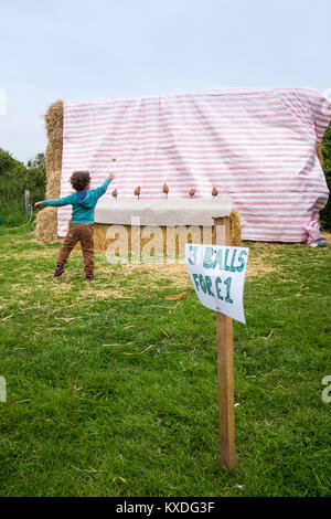 The Coconut shy at the village fete in Walberswick , Suffolk , England ...