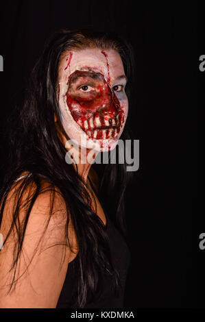 Scary monster zombie mask with bloody face and evil expression on ...