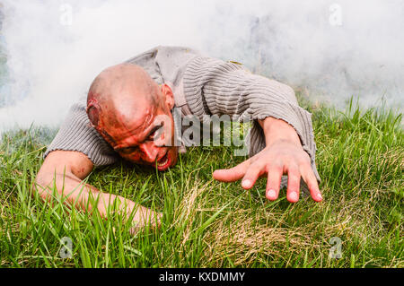 A living corpse climbing from the grave Stock Photo - Alamy