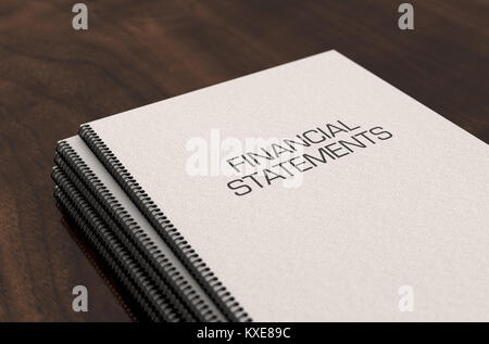 A pile of wire bound financial statement documents in a pile on a ...