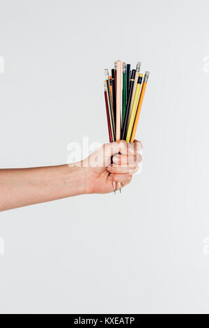 Female hand with pencils on white background Stock Photo - Alamy