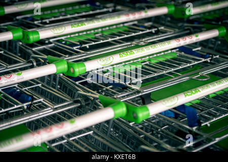 Asda supermarket trolleys stacked and ready for use Stock Photo - Alamy
