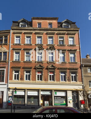 An early 20th Century two storey building housing three retail shops in ...