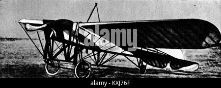 Louis Bleriot, a pioneer in aviation, stands next to his aeroplane on a ...