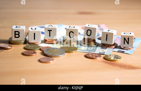Bitcoin word written on wood cube Stock Photo - Alamy