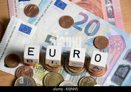 Ten euro banknote with number 9 written on it symbolizing devaluation ...