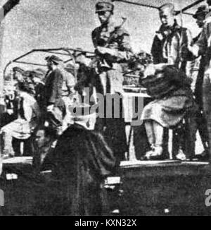 This historical photograph depicts the execution of Polish civilians by ...