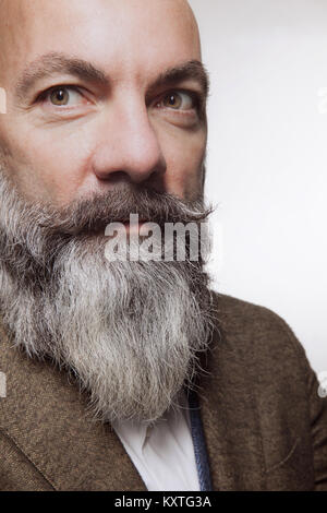 Studio portrait of a middle-aged businessman on a white background ...