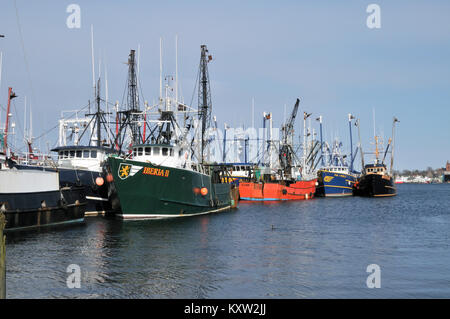 Fishing trawlers rafted along side each other at wharf in New Bedford ...