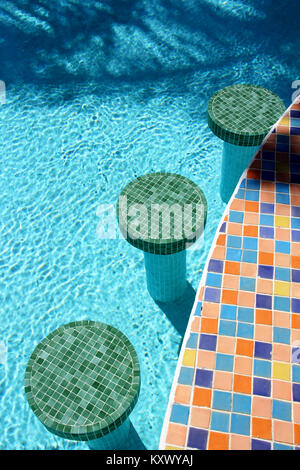 Colourful mosaic bar stools in a swimming pool Stock Photo - Alamy