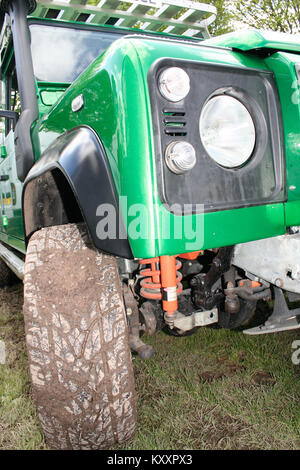 Mud covered Land Rover Defender 90 soft top with Land Rover Experience ...