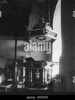 A 1912 photograph by Anders Beer Wilse showing the baptismal font of ...