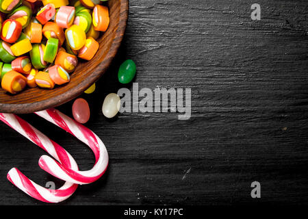Different baby sweets in bowls. On the black chalkboard Stock Photo - Alamy