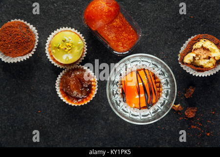 Italian Neapolitan sweets on a black stone background Stock Photo - Alamy