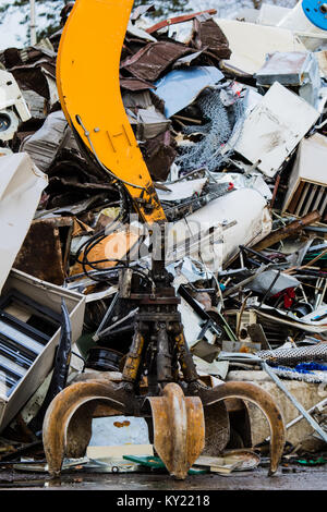 Powerful mechanical grabbing arm is the force that moves old scrap ...