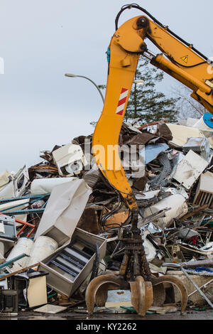 Powerful mechanical grabbing arm is the force that moves old scrap ...