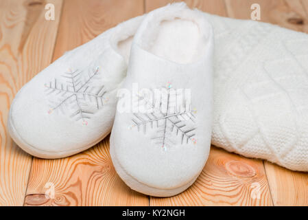 close-up of winter xmas knitted cozy gloves on wooden table Stock Photo ...