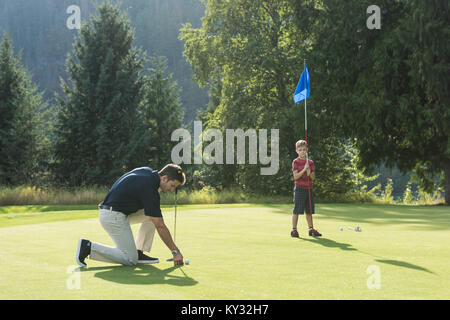 father and son playing golf Stock Photo - Alamy
