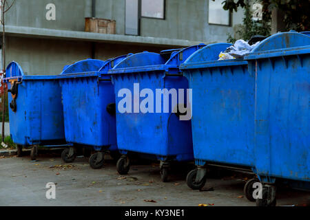 Large garbage containers, trash dumpsters and bins standing in row ...