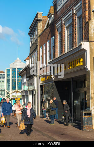 People shoppers shopping outside Marks and Spencer M&S M & S store shop ...