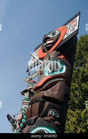 Colorful indigenous Totem Poles representing art and religious symbols ...