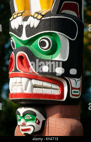 Colorful indigenous Totem Poles representing art and religious symbols ...