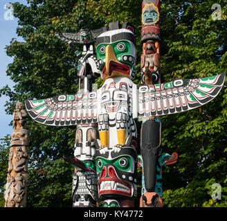 Colorful indigenous Totem Poles representing art and religious symbols ...
