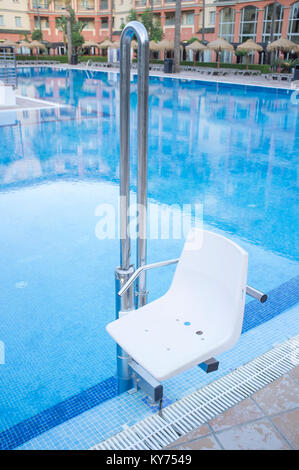 Pool lift device for disabled people in outdoor swimming pool Stock ...