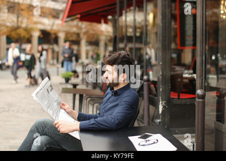 journalist enjoying with reading newspaper columns and articles with ...