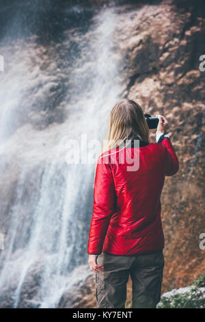 woman traveler enjoying view of waterfall Stock Photo - Alamy