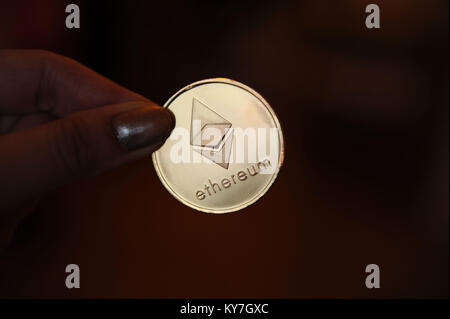 In this photo illustration, the Ethereum logo seen displayed on a ...