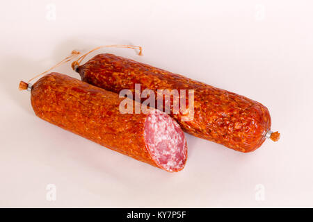 Two Salamy sausages isolated Stock Photo - Alamy