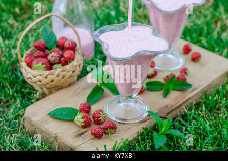 Strawberrie smoothie outside summer, basket with strawberries Stock ...