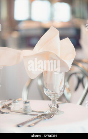 Table setting with glass and napkin in a restaurant Stock Photo - Alamy