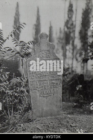 A historical photograph of a Turkish cemetery, showing burial practices ...