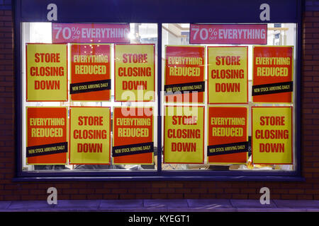 store closing down posters in the window of a woolworths store,england ...