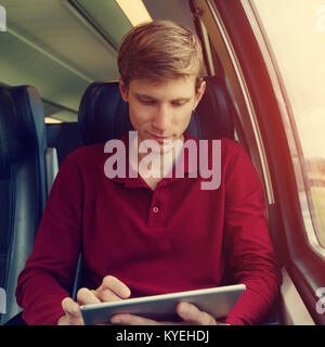 handsome man riding on a train Stock Photo - Alamy