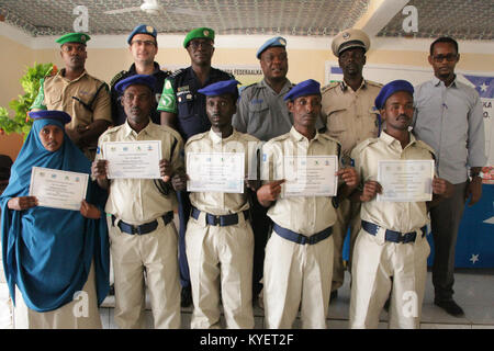 Photograph of senior officers from the Somali National Army (SNA), AMISOM, and EUTM handing over ...