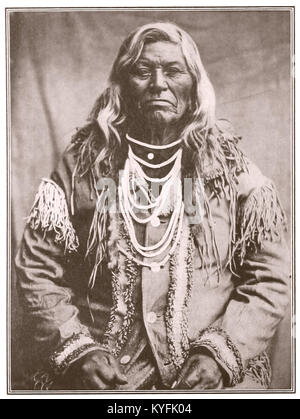 This photograph by Lee Moorhouse depicts the Cayuse twins in cradles ...