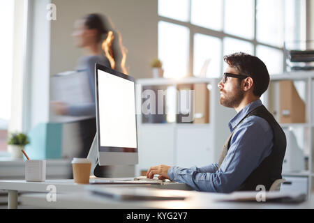 Young creative designer man working at office with computer laptop as ...
