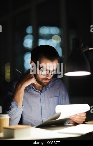 Young businessman employee and too much work in the office Stock Photo ...