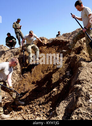 Afghan national army soldier serves the volleyball during a game held ...