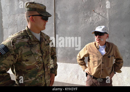 Carl Linderman (right), a native of Myrtle Point, Ore. speaks with ...