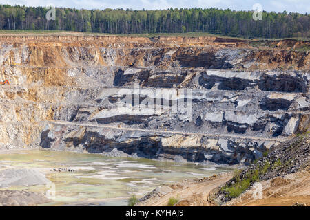 Stone rock quarry open cast mining side of hills rural mountain Stock ...