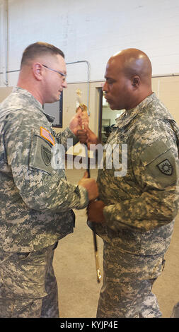 Command Sgt. Maj. Nathan Tolliver with his family following a change of ...