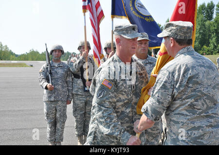 Lt. Col. Rob Larkin receives the colors from Maj. Gen. Edward W. Tonini ...
