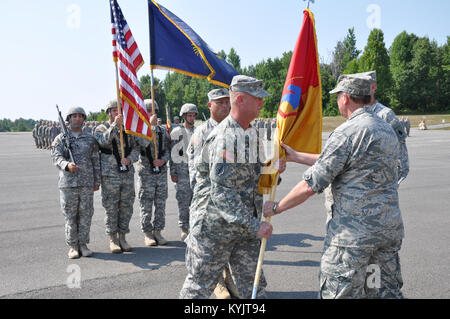 Lt. Col. Rob Larkin receives the colors from Maj. Gen. Edward W. Tonini ...