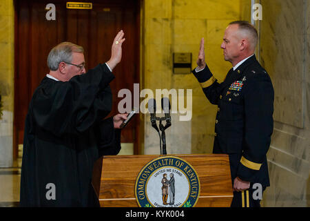 Brig. Gen. Stephen R. Hogan swears in Col. Thomas Gaston Jr. during a ...